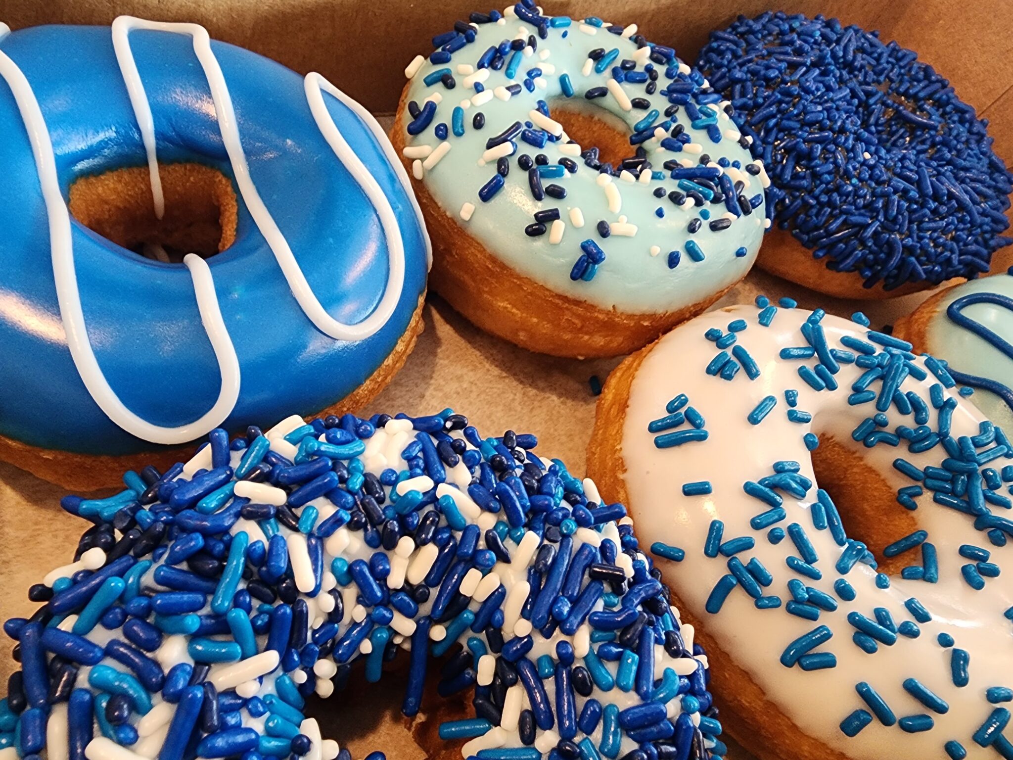 The sale of blue doughnuts is helping raise awareness of child abuse ...